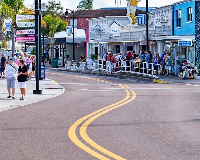 Tarpon Springs' downtown area buzzes with activity as visitors line up for local attractions and shops selling Greek specialties.