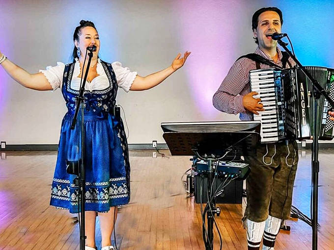 Musicians in traditional German attire entertain the crowd at Springtoberfest, bringing Bavarian flair to this springtime celebration.