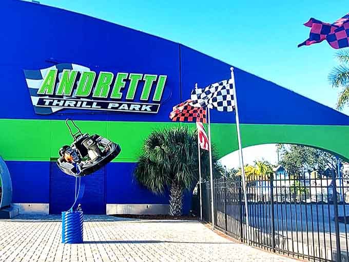 The vibrant blue and green entrance to Andretti Thrill Park stands like a checkered flag waving you toward adventure in Melbourne, Florida.