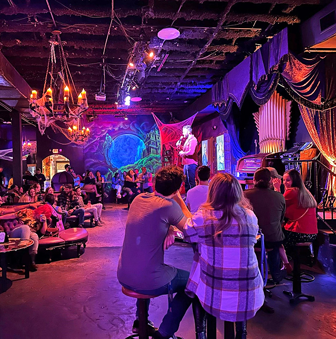 Step into Orlando's Cocktails & Screams, where performers entertain patrons under eerie purple lighting while horror-themed murals create the perfect backdrop for your nightmarish night out.