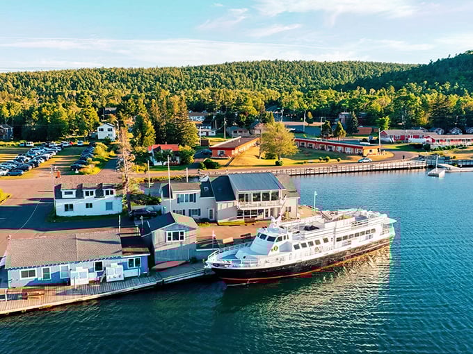 Copper Harbor's pristine waterfront welcomes visitors with boats bobbing gently against the backdrop of endless northern forests.