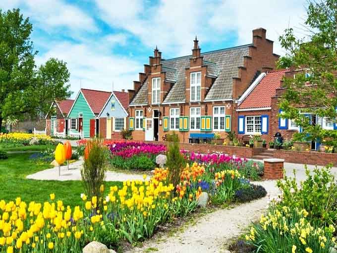 A postcard-perfect scene of Dutch architecture with vibrant tulips dancing in the foreground – Holland, Michigan's little Netherlands doesn't skimp on authenticity.