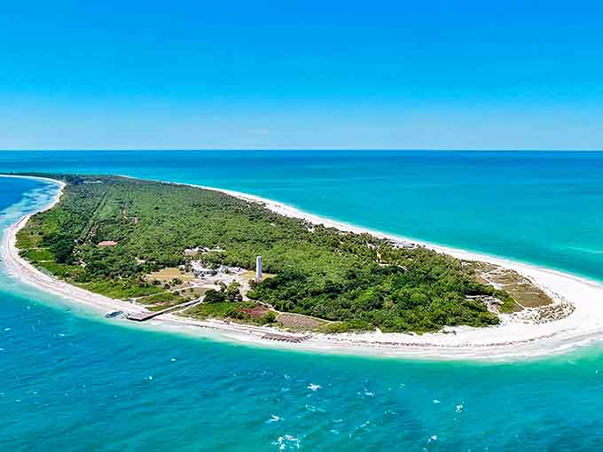 Aerial view of Egmont Key State Park, where turquoise waters embrace pristine shores and lush greenery creates a hidden paradise.