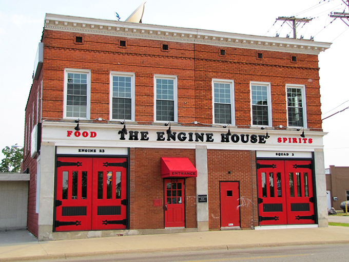 The iconic brick exterior of The Engine House, with its signature red doors paying homage to its firefighting roots.
