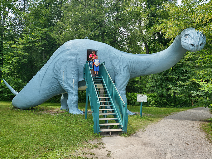 The iconic blue brontosaurus welcomes visitors with its long neck stretching skyward – a prehistoric greeter frozen in time.