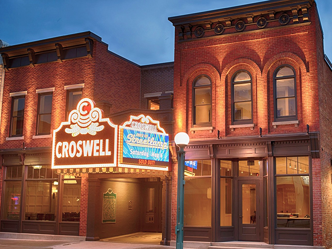 The iconic Croswell marquee lights up downtown Adrian, a beacon of culture that's been dazzling Michigan since the 19th century.