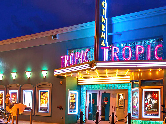 The Tropic Cinema's electric blue facade and vibrant neon signage light up Eaton Street like a beacon for film lovers in Key West.