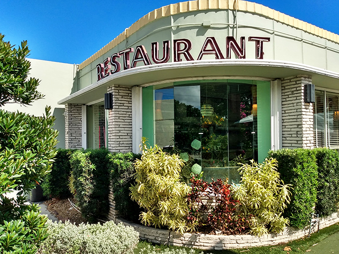 The curved corner entrance of Howley's beckons with mid-century charm, promising comfort food that's stood the test of time since 1950.