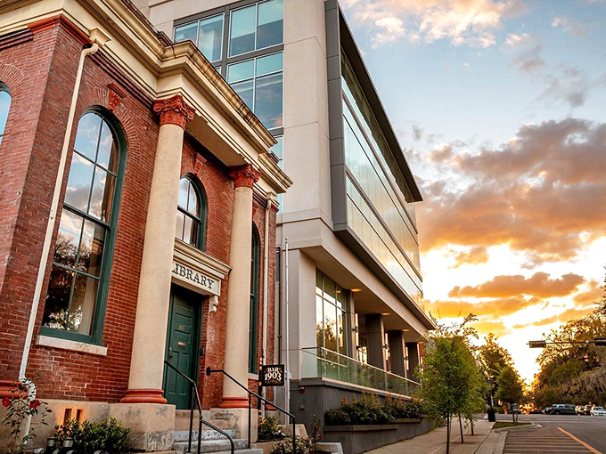 Where past meets present: Bar 1903's striking exterior blends historic red brick with modern glass, creating an architectural conversation across time.