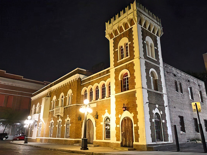 The Castle's majestic exterior stands like a medieval time traveler in Ybor City, its illuminated facade promising nocturnal adventures beyond the ordinary Tampa experience.