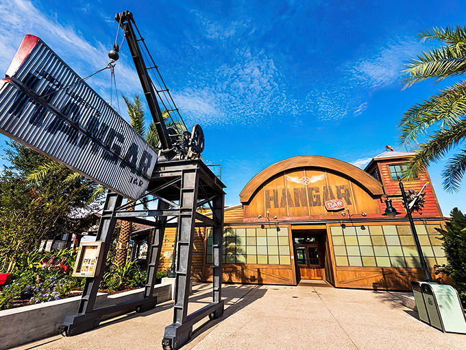 The iconic hangar facade welcomes adventurers with its vintage crane and weathered signage&mdash;Indiana Jones would feel right at home.