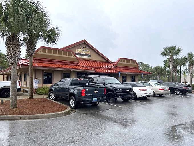 The welcoming exterior of Andy's Flour Power beckons with its cheerful red roof and promise of homemade delights inside.