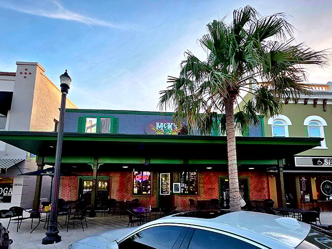McK's Tavern's emerald green awning and brick facade create that perfect "Ireland took a wrong turn and ended up in Florida" vibe that somehow works brilliantly.
