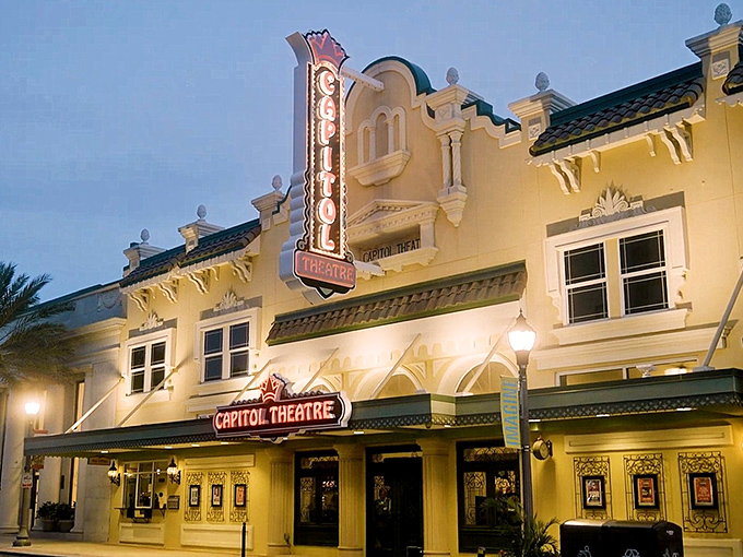 The iconic yellow fa&ccedil;ade of the Bilheimer Capitol Theatre glows warmly at dusk, its vintage marquee beckoning both the living and perhaps... others.