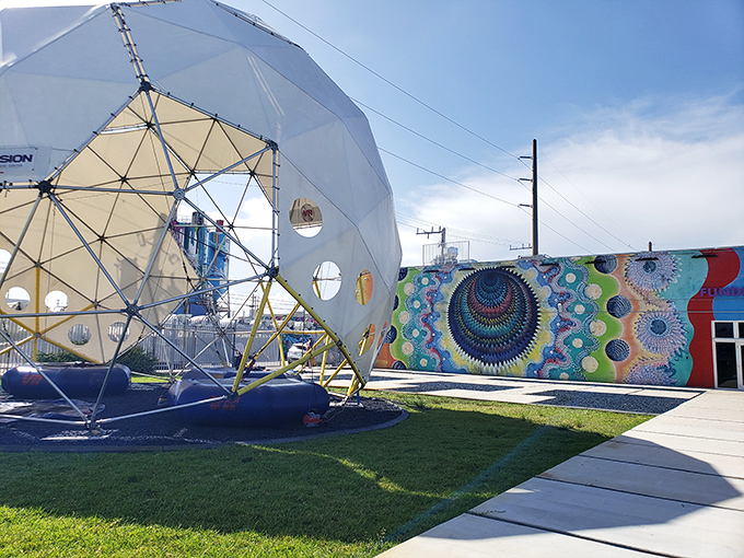 FunDimension's futuristic dome entrance stands like a portal to another dimension, complete with vibrant murals that hint at the wonders inside.