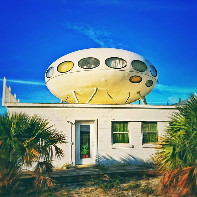 The iconic Futuro House perches like a landed UFO atop its beach home base, ready for takeoff or tourists—whichever comes first.