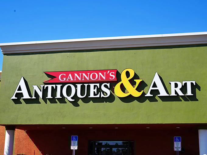 The vibrant green facade of Gannon's Antiques & Art Center stands like a gateway to treasures waiting to be discovered inside.