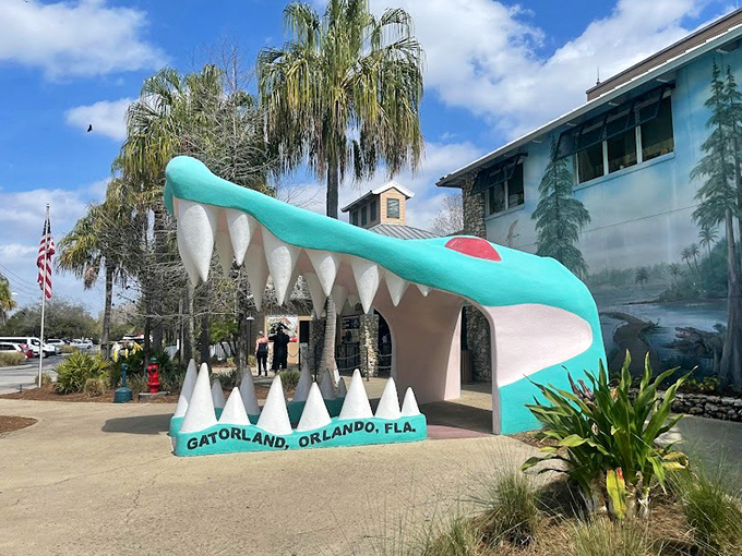 The iconic teal gator mouth entrance welcomes visitors to Orlando's most chomptastic attraction, a Florida landmark since long before Mickey moved to town.