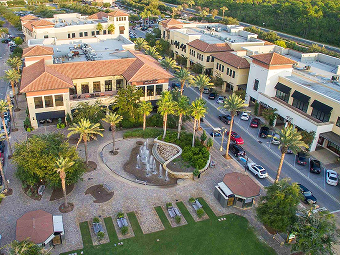 Grand Boulevard at Sandestin: Mediterranean elegance meets Florida sunshine in this aerial view of terracotta roofs and swaying palms. Shopping paradise awaits!