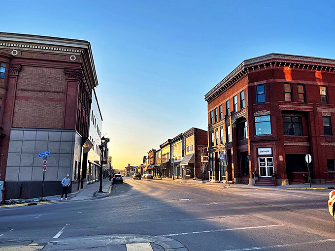 Hancock's historic downtown glows in the golden hour light, brick buildings standing proud against the Michigan sky.