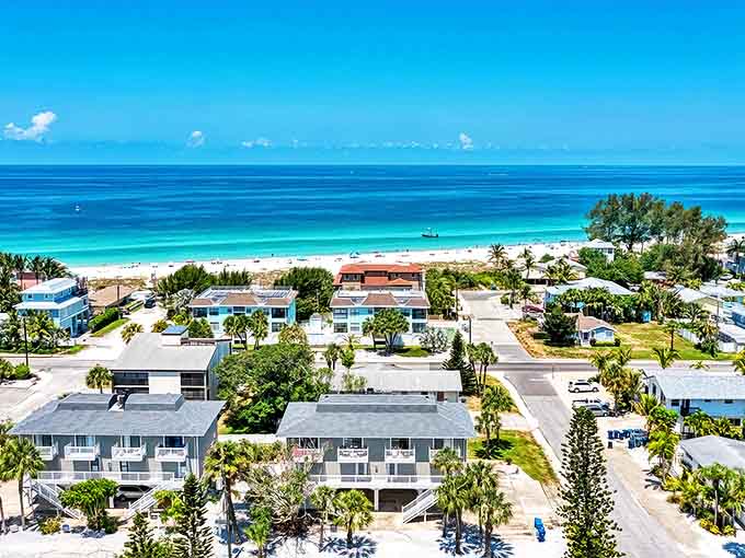 Where pastel-colored beach houses meet pristine shorelines, creating a postcard-perfect scene that screams "vacation mode activated!"