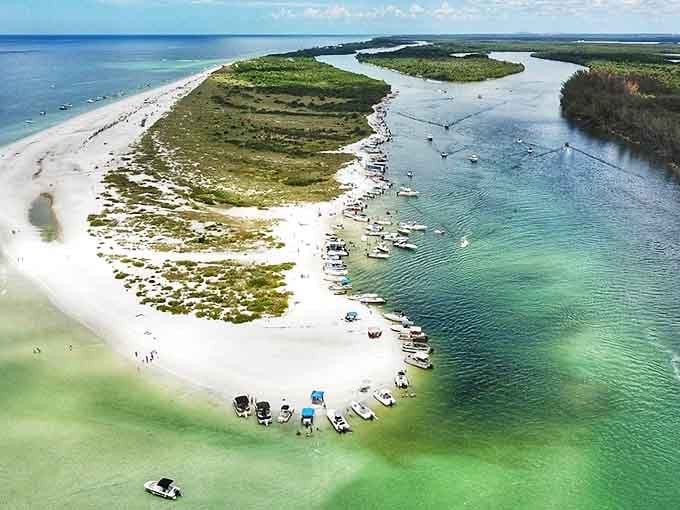 Keewaydin Island: Paradise found! This aerial view showcases nature's perfect design &ndash; a pristine sandbar embraced by waters in fifty shades of blue.