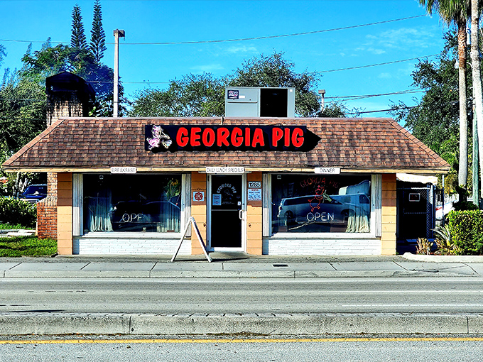 The unassuming brick facade of Georgia Pig BBQ hides a world of smoky delights within &ndash; proof that great barbecue doesn't need fancy packaging.