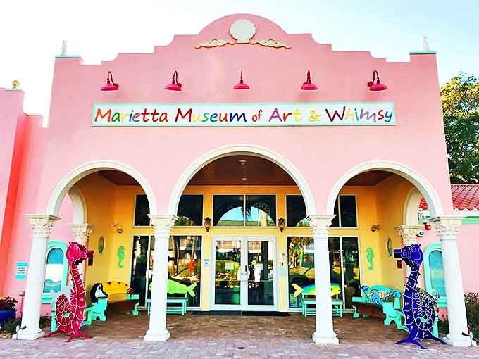 The bubblegum-pink Spanish facade of the Marietta Museum stands out like a flamingo at a penguin convention, promising whimsy before you even step inside.