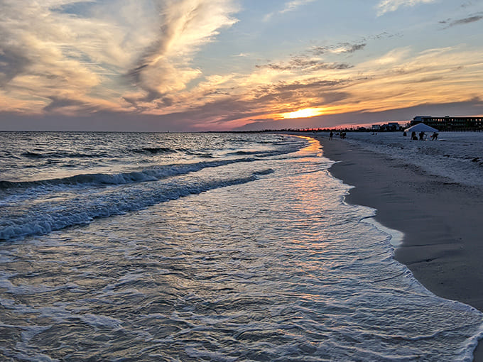 Mexico Beach's shoreline stretches like nature's welcome mat, where cotton-candy clouds meet emerald waters in a daily sunset spectacle worth bottling.