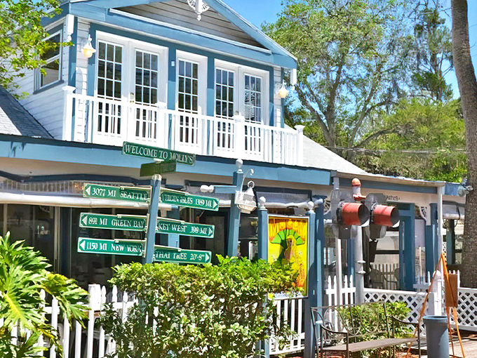 The charming blue exterior of Molly's welcomes visitors with whimsical directional signs pointing to faraway places &ndash; a perfect introduction to Key West's laid-back vibe.