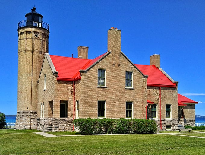 Standing proud since 1889, the Old Mackinac Point Lighthouse's distinctive red roof and honey-colored tower create a postcard-perfect Michigan landmark.