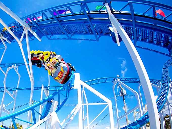 The Blue Streak roller coaster twists and turns against a perfect Florida sky &ndash; proof that adrenaline comes in all shades of azure at Race City.