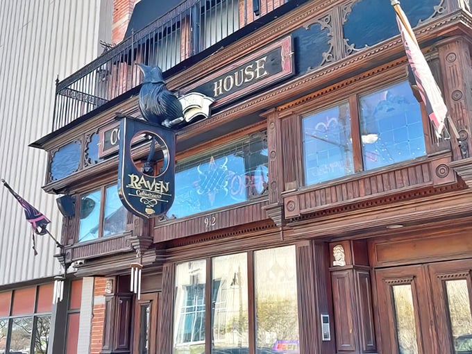 The Raven Caf&eacute;'s fa&ccedil;ade beckons literary souls with its vintage charm and that magnificent book-wielding raven sculpture &ndash; Port Huron's most photogenic storefront!