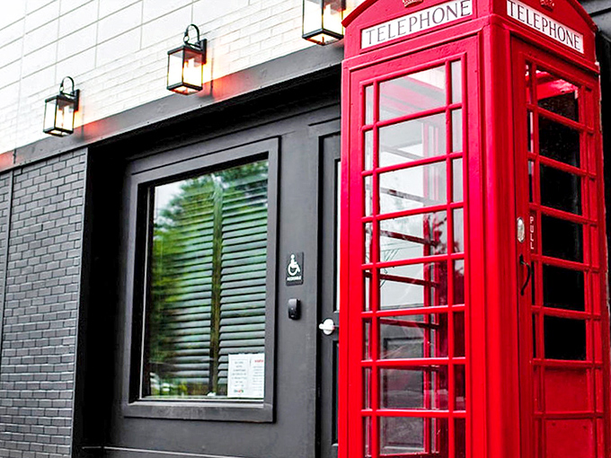 The iconic red telephone booth stands as a mysterious portal to Miami's most enchanting speakeasy, beckoning those in the know with vintage charm.