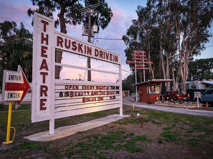 The iconic white marquee of Ruskin Drive-In glows against the twilight sky, a beacon of nostalgia in modern Florida.