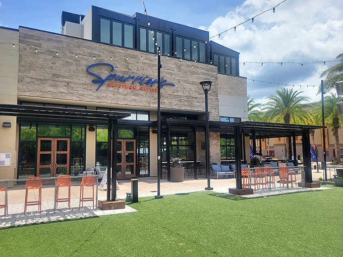 Modern stone façade meets sports legacy at this Gainesville hotspot, where string lights create an inviting atmosphere that promises more than your average sports bar experience.
