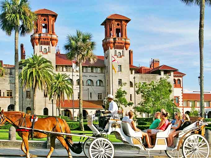 St. Augustine's iconic towers reach skyward as horse-drawn carriages transport visitors through centuries of history in America's oldest city.