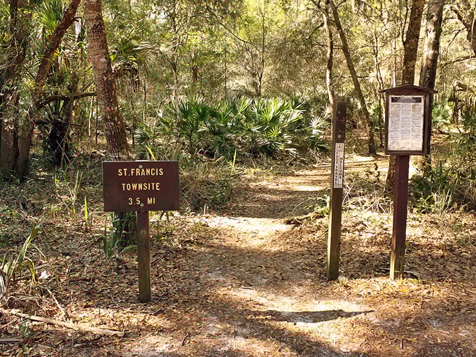 The trailhead beckons with rustic charm, a wooden sign pointing the way to St. Francis Townsite, 3.5 miles of history waiting to be discovered.