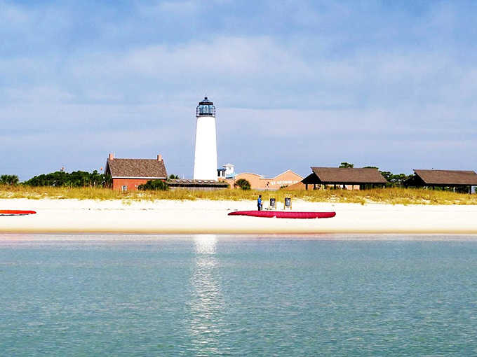St. George Island's pristine shoreline meets the Gulf waters, where the iconic lighthouse stands sentinel against a perfect blue sky. Paradise found!