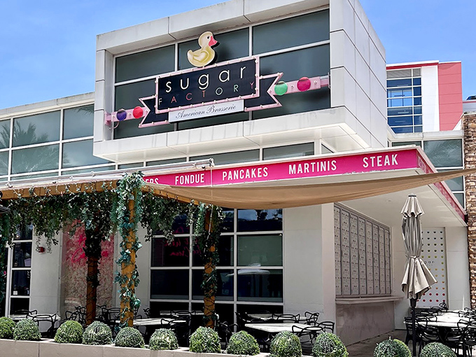 Sugar Factory's playful exterior beckons sweet-toothed adventurers with its iconic duck logo and promises of sugary delights within.