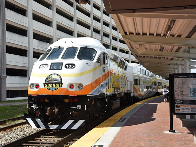 The distinctive yellow and orange SunRail train pulls into the station, a welcome sight for commuters tired of battling Orlando's infamous I-4 traffic.