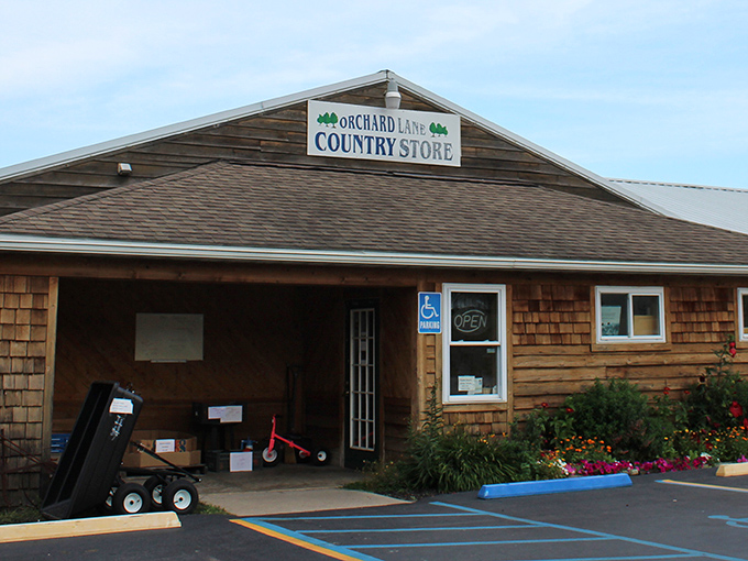 The rustic wooden exterior of Orchard Lane Country Store welcomes visitors with its charming simplicity and promise of homemade treasures within.