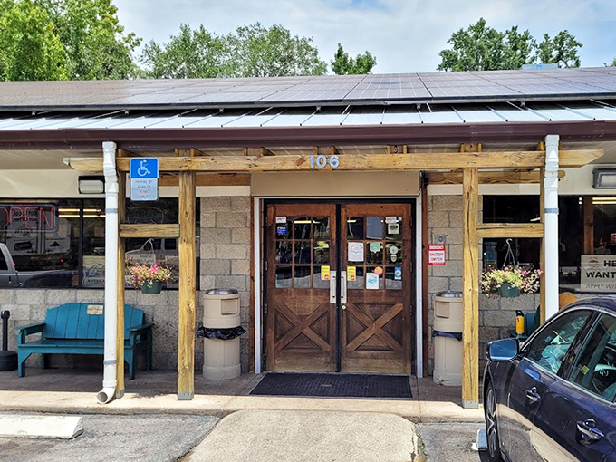 The unassuming exterior of Pearl Country Store & Barbecue hides a world of smoky delights behind those wooden doors.