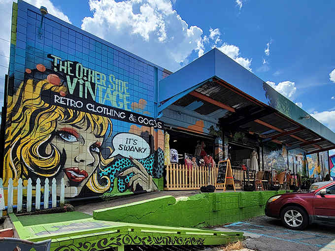 The vibrant blue facade of The Other Side Vintage screams "come inside!" with its comic-book style mural and retro charm.