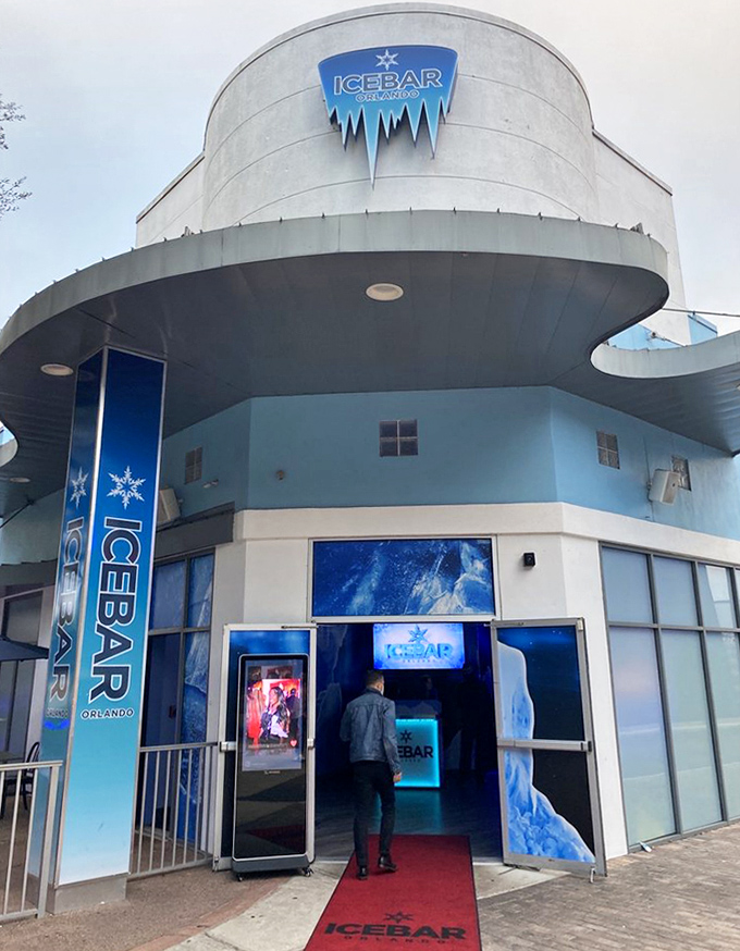 The striking blue exterior of ICEBAR Orlando stands out like a frozen mirage on International Drive, promising arctic adventures in the Florida heat.