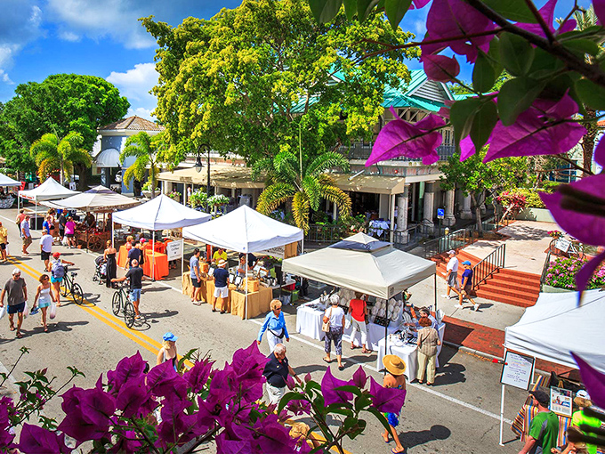A vibrant tapestry of life unfolds at Third Street South, where palm trees stand guard over a marketplace buzzing with weekend energy.