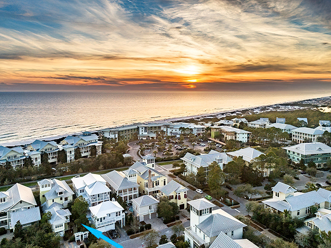 Sunset paints the sky in impossible colors over WaterColor's pristine shoreline &ndash; Mother Nature showing off again with her evening light show.