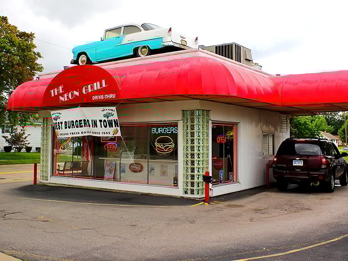 A slice of American nostalgia with a cherry-on-top '55 Chevy, The Neon Grill's crimson awning beckons like a time portal to simpler days.