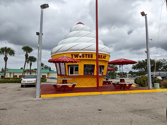 The iconic Twistee Treat building stands proudly in Fort Myers, its giant soft-serve shape beckoning to ice cream lovers like a sweet mirage in the Florida heat.