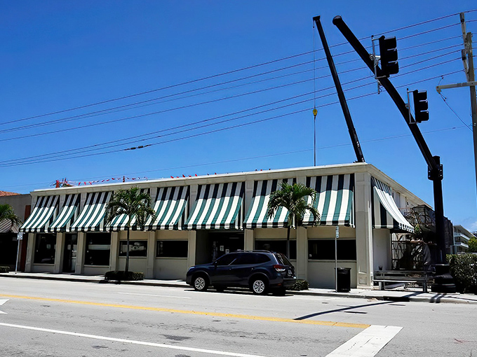 Those iconic green and white striped awnings aren't just decoration &ndash; they're a portal to a simpler, friendlier era of American commerce.